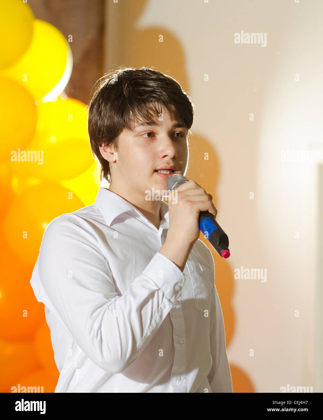 Teenager singing at the stage Stock Photo - Alamy