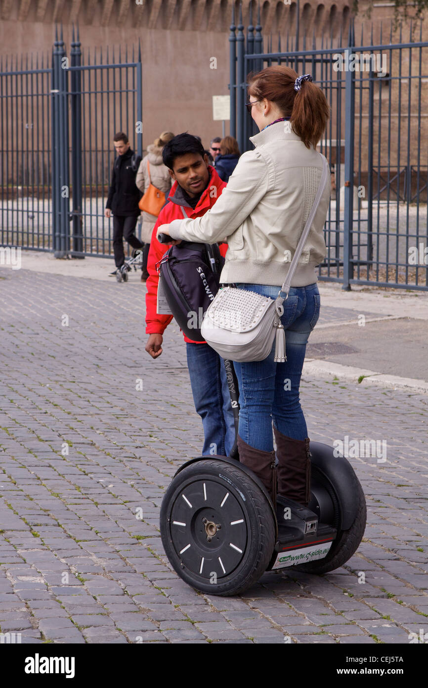 A woman practices using a Segway used for touring the city of Rome ...