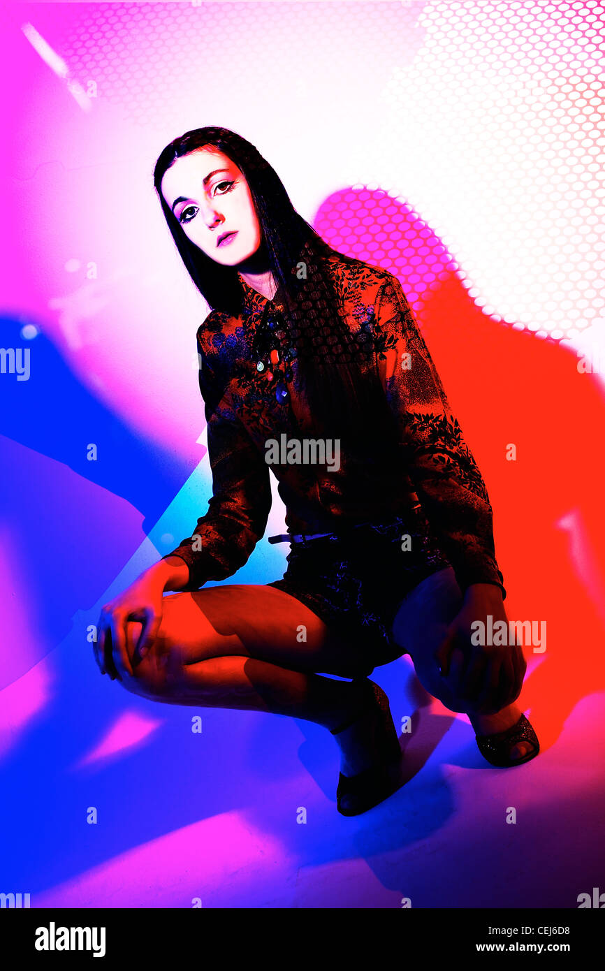 Photograph of a model in the studio with very vivid colour shadows ...