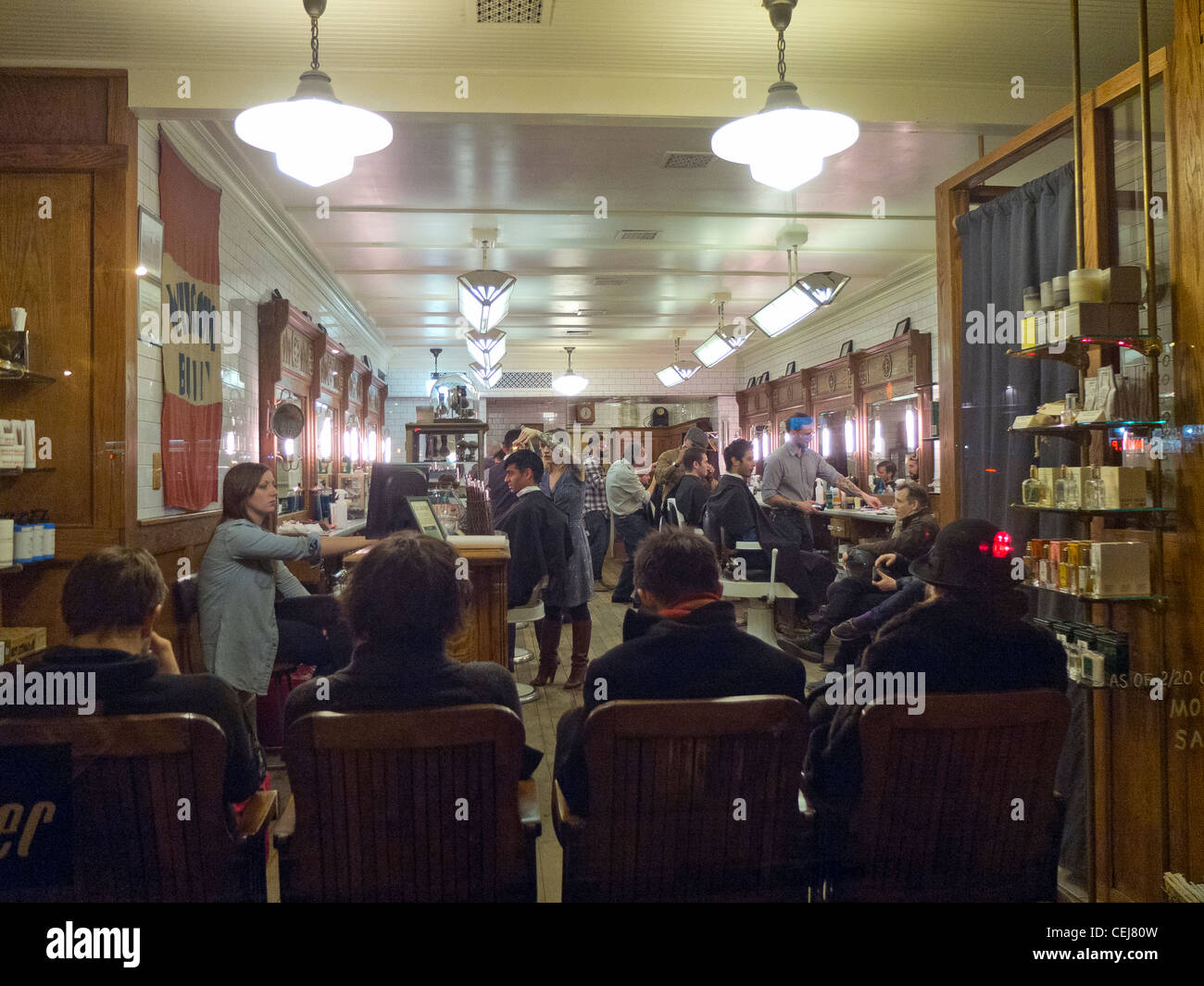 people waiting for a haircut in a barber shop in Greenwich Village ...