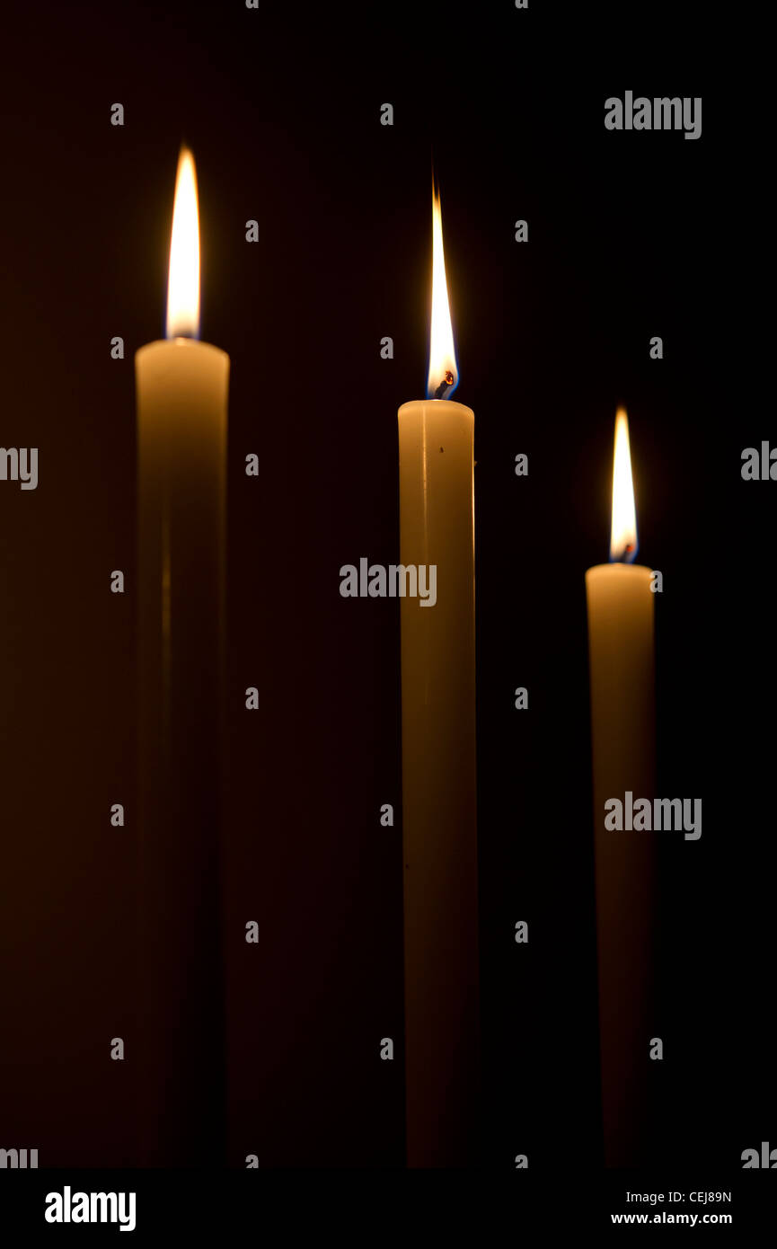 Three burning candles Stock Photo - Alamy