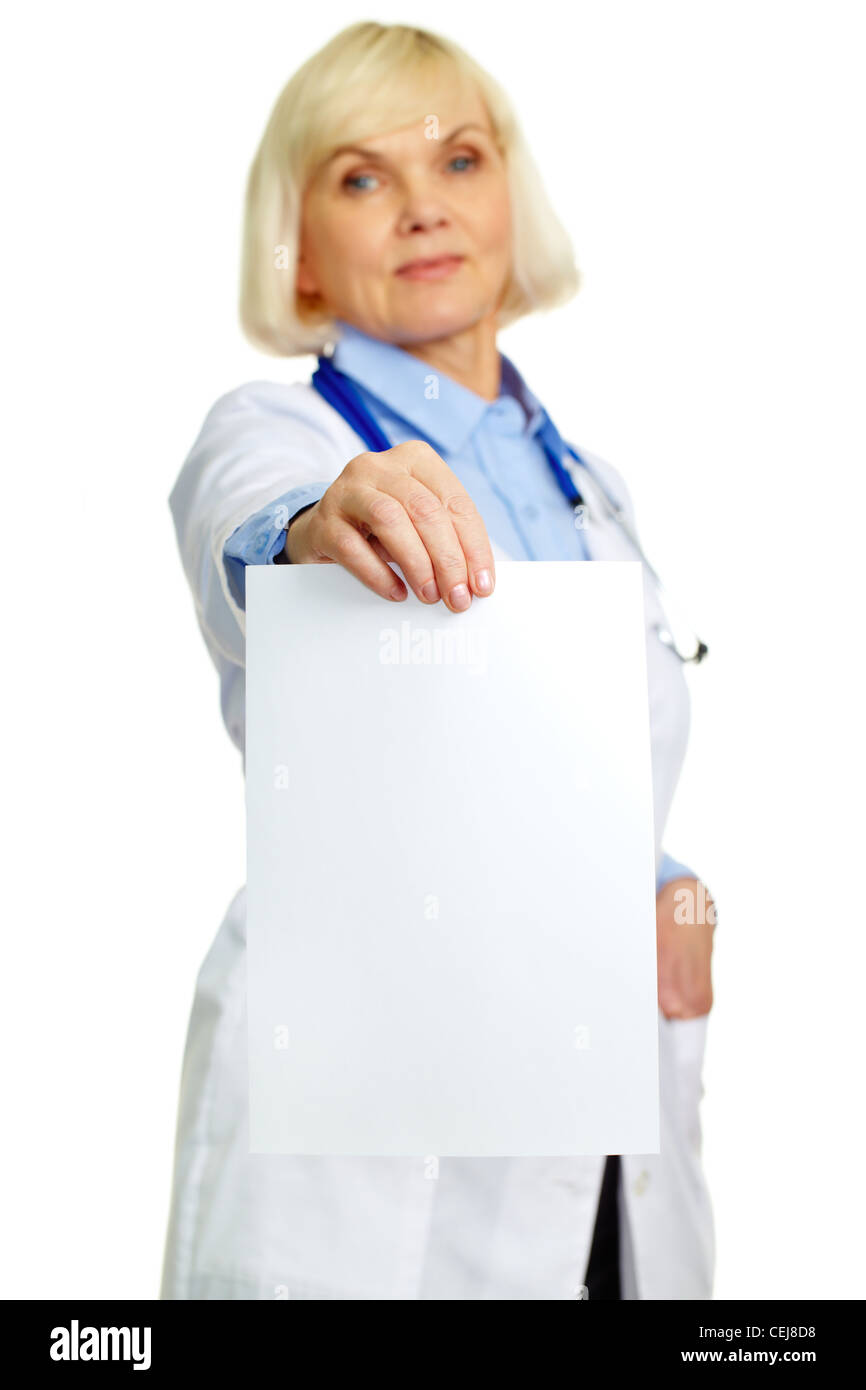 Vertical shot of a female doctor holding a blank sheet of paper Stock ...