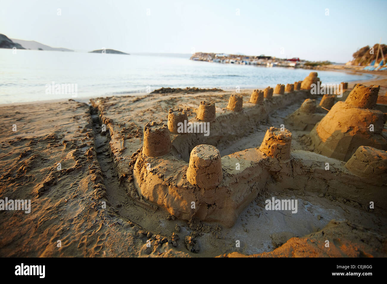 Sand fortress in the light of sunset Stock Photo - Alamy