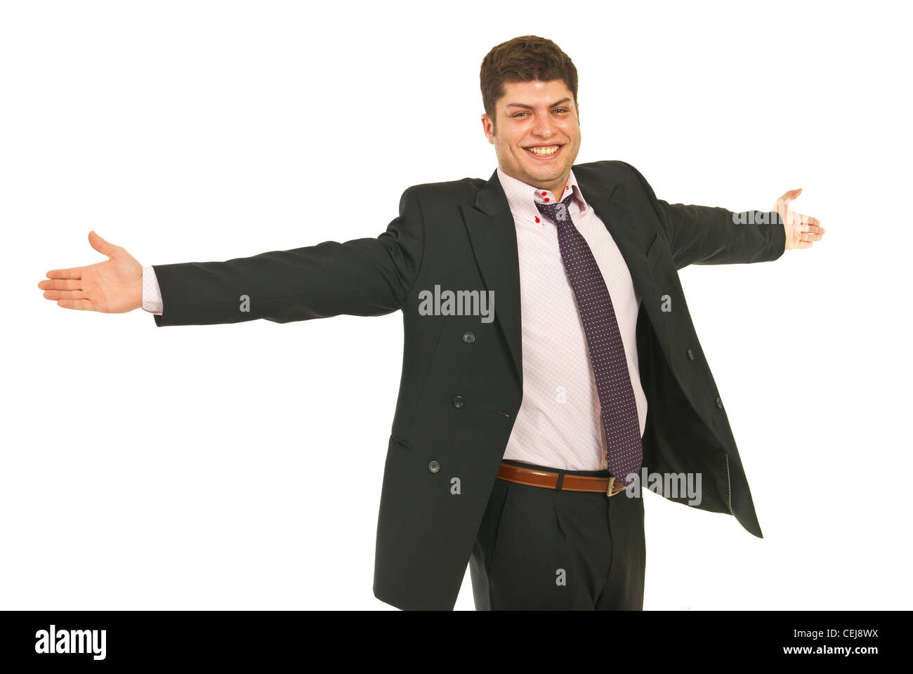 Successful business man with arms outstretched isolated on white ...