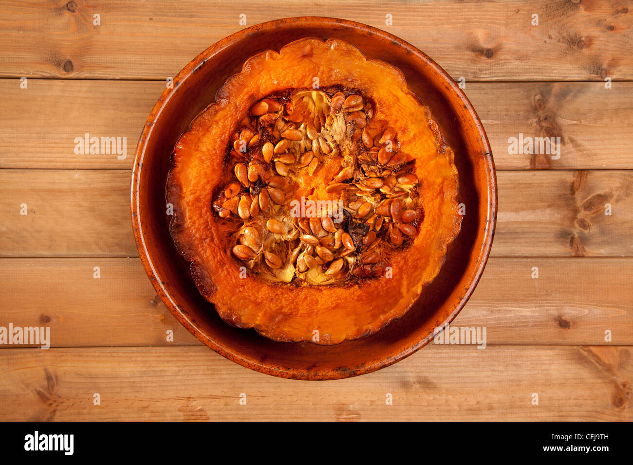 cutted half pumpkin roasted pumpkin macro closeup seeds Stock Photo - Alamy