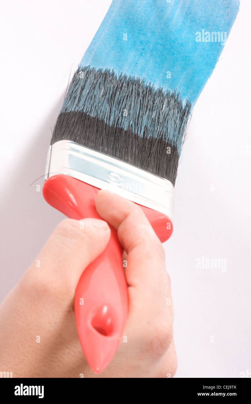 house painter painting a wall in motion Stock Photo - Alamy