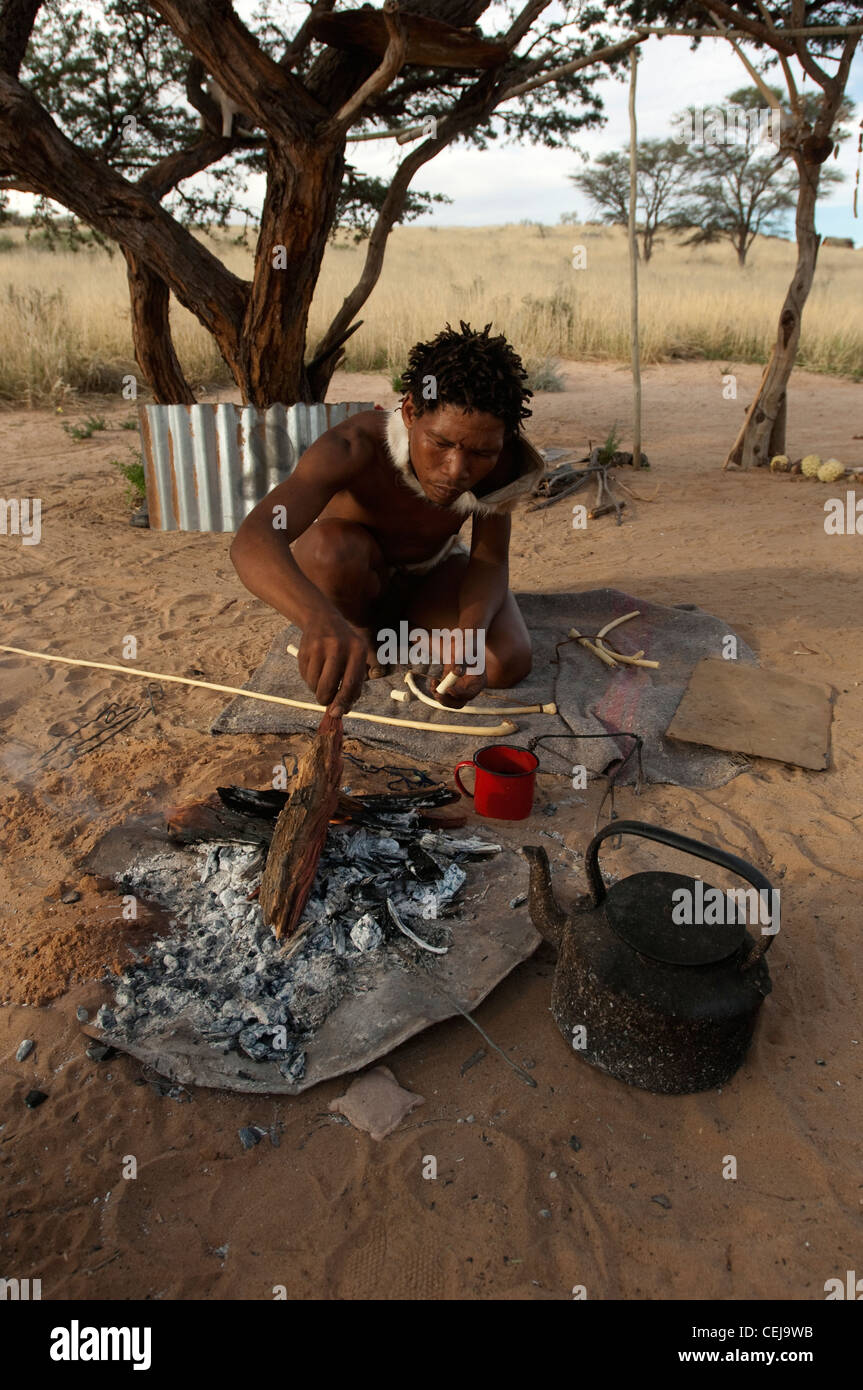Bushman making weapons at the Bushman cultural village,near Xaus Stock ...