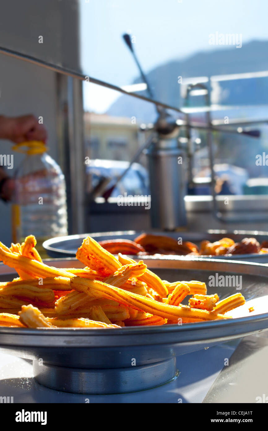 churros fried flour fritters spanish in the market Stock Photo - Alamy