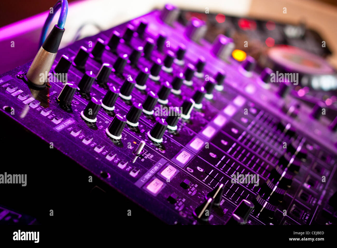 mixer console in purple light Stock Photo - Alamy