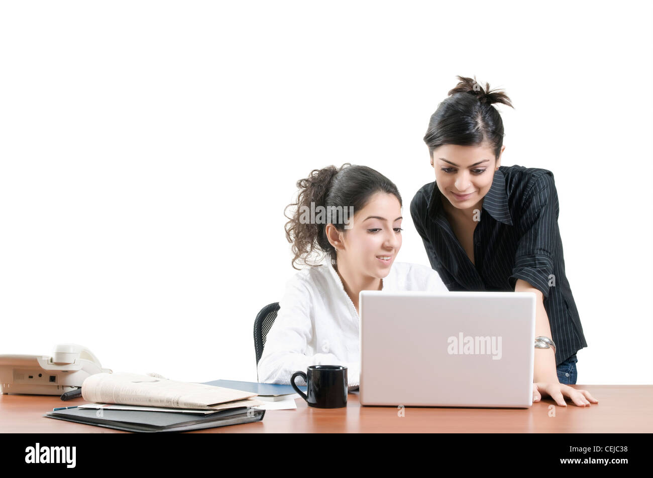 two girls working Stock Photo - Alamy