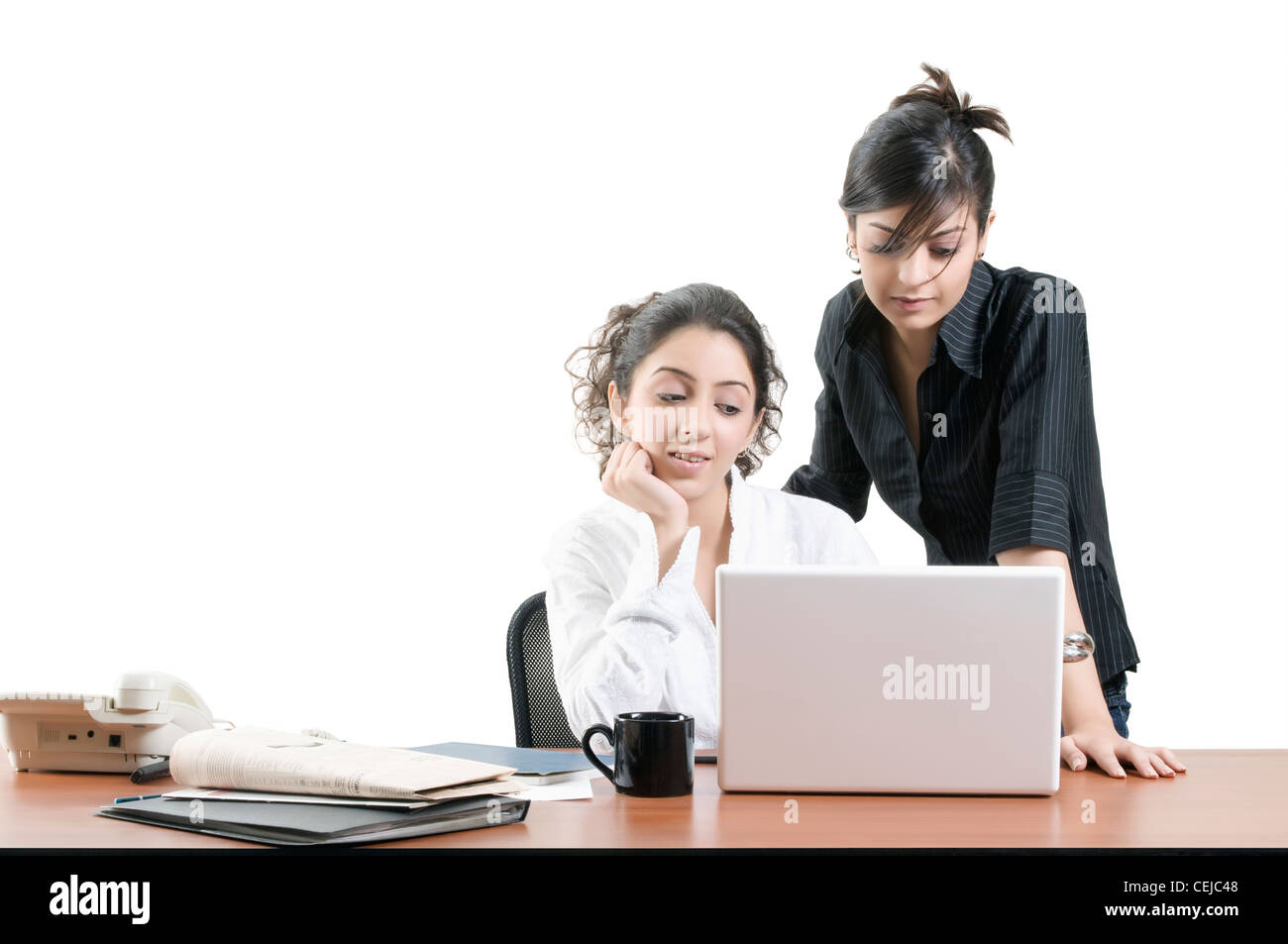 two girls working Stock Photo - Alamy