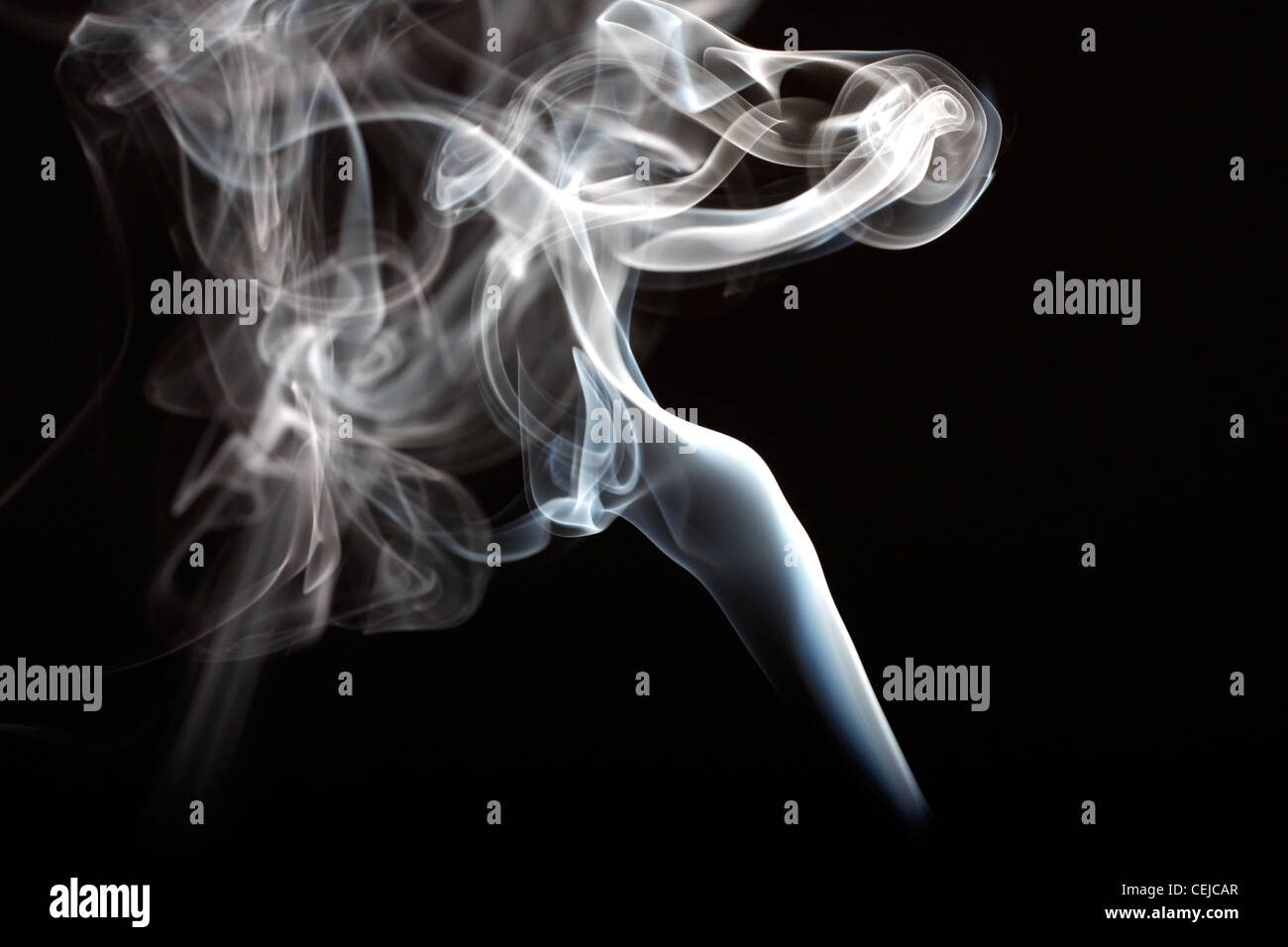 Abstract smoke curling and creating beautiful shapes Stock Photo - Alamy