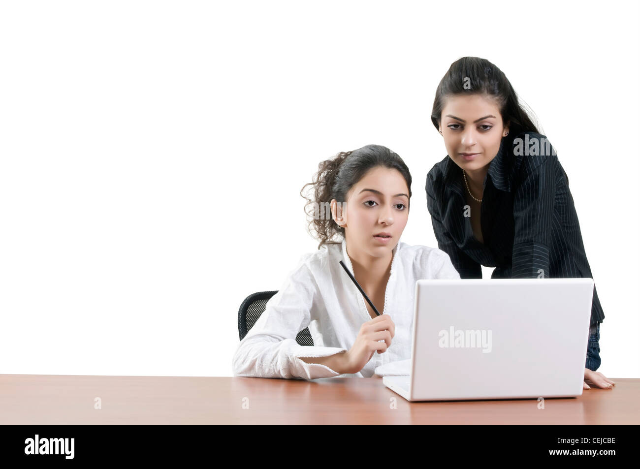 two girls working Stock Photo - Alamy