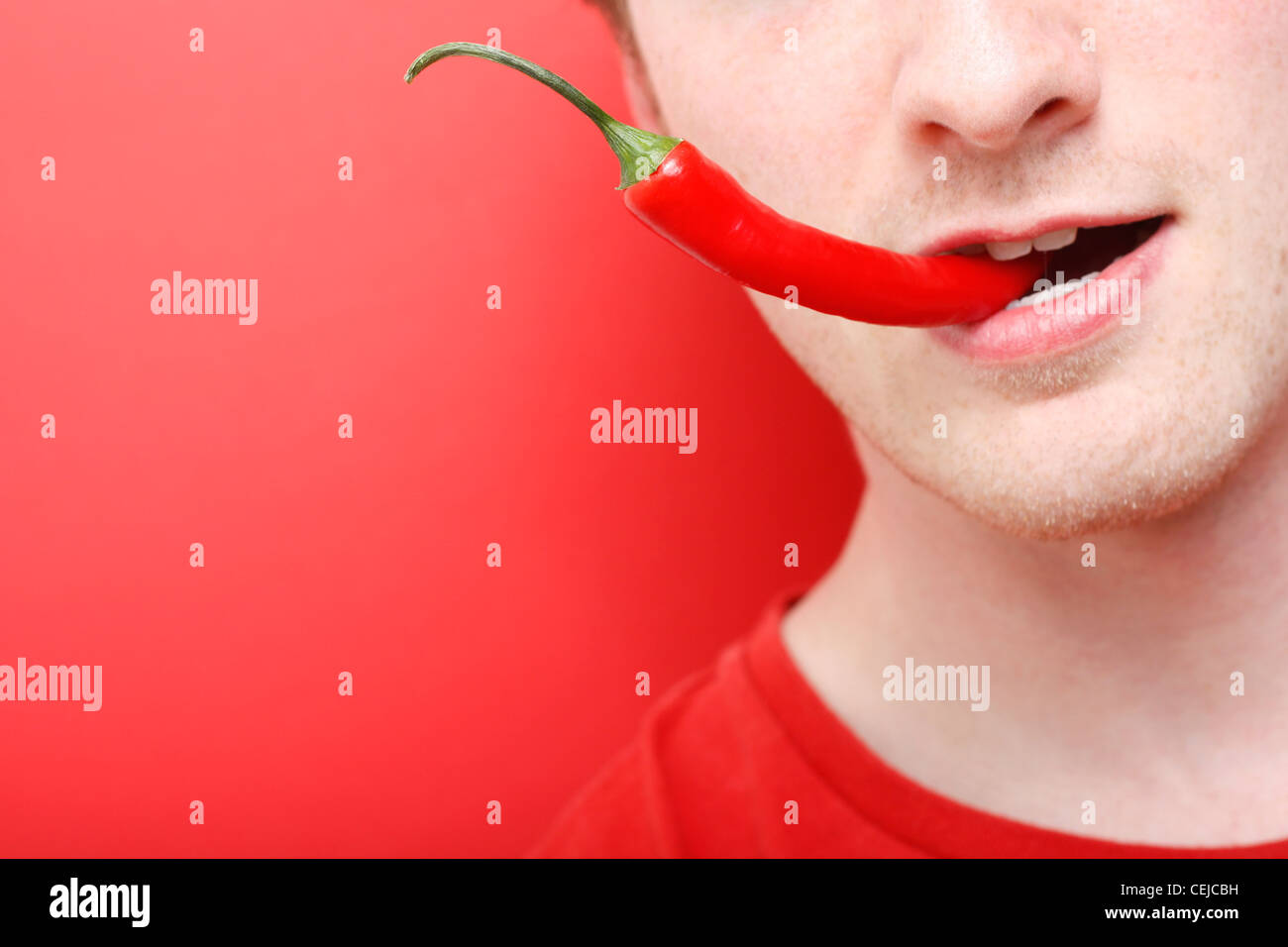 Man Eating Chili Pepper High Resolution Stock Photography and Images ...