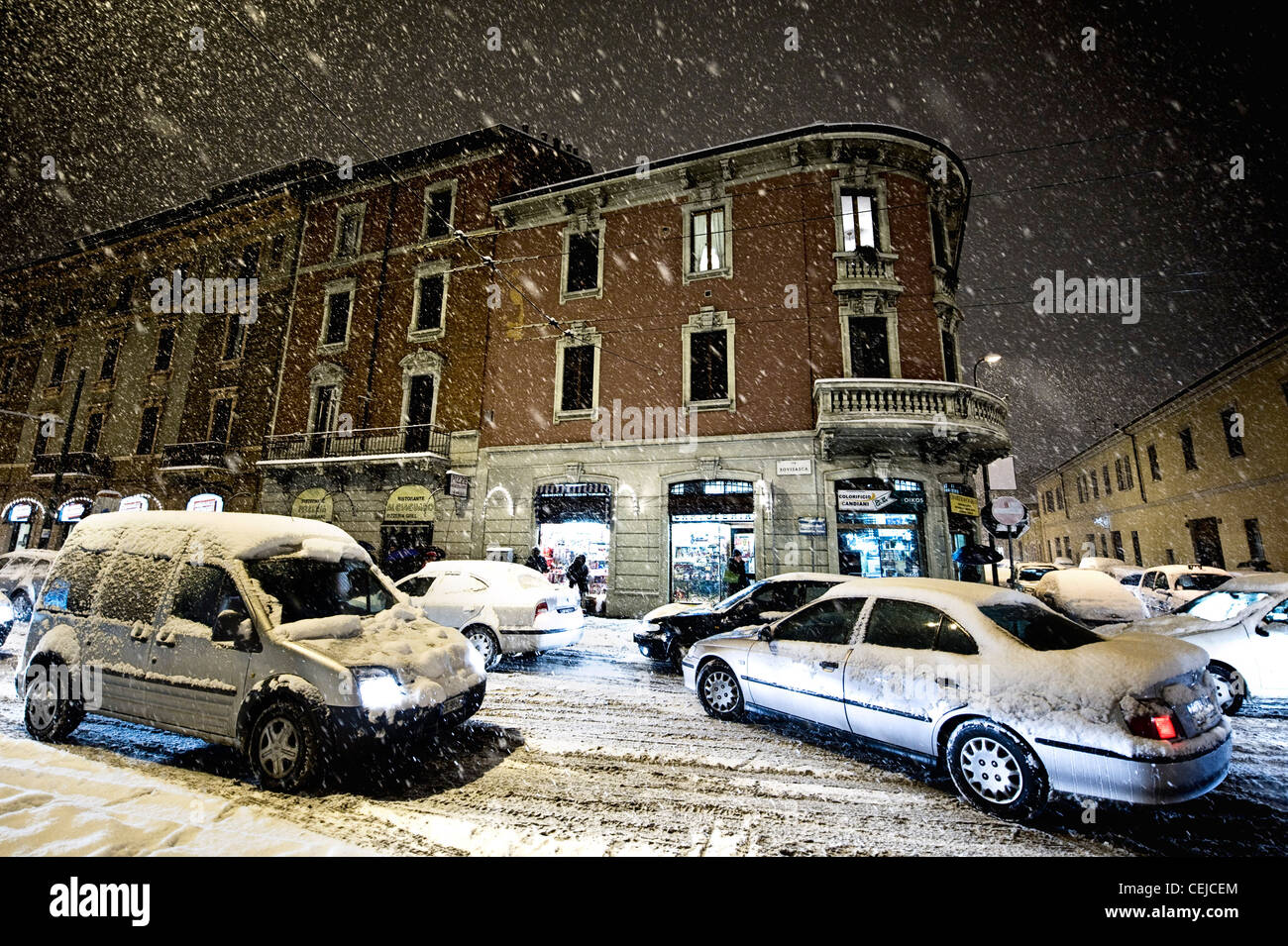 traffic jam in a snowy street in milan, italy Stock Photo - Alamy