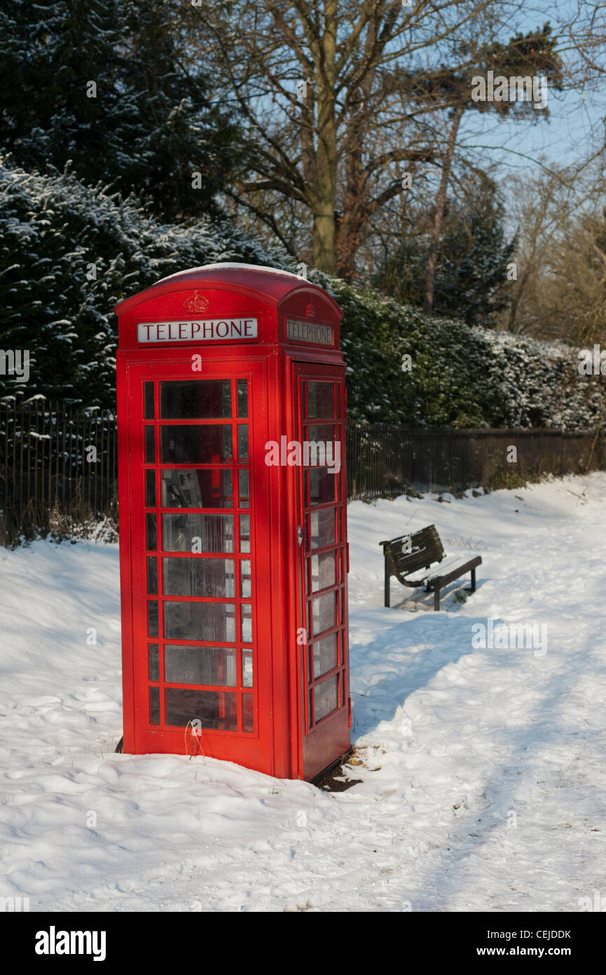 Red telephone box in the snow in Cambridge UK Stock Photo - Alamy