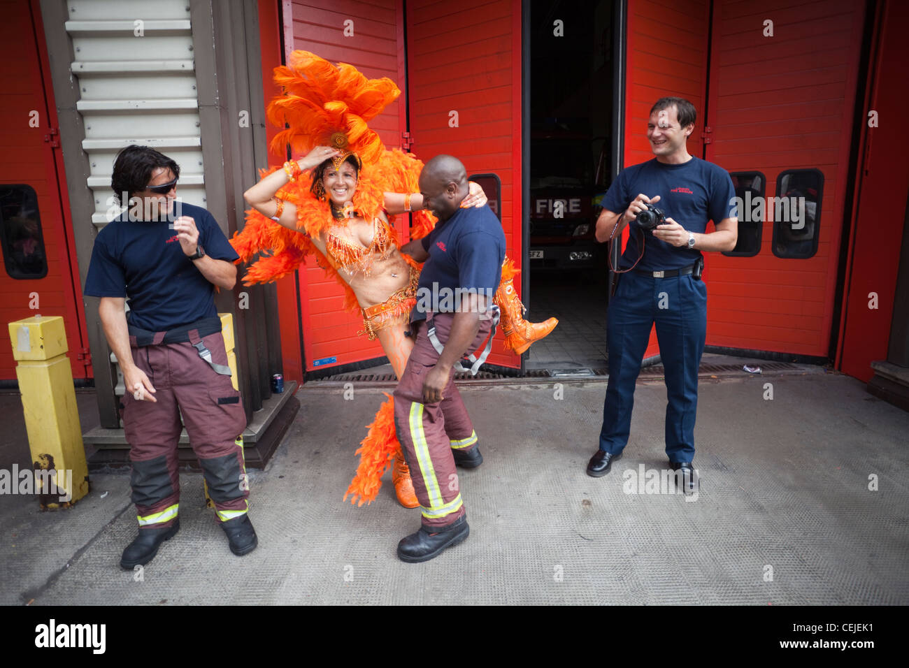 England, London, Notting Hill Carnival, Fireman and Female Participant ...