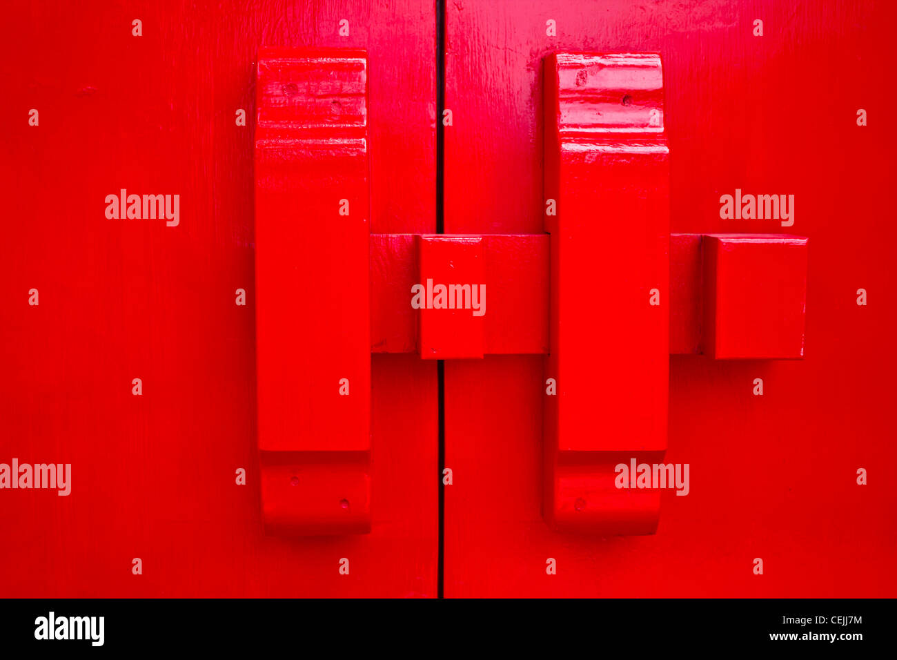 Red door with wood lock Stock Photo - Alamy