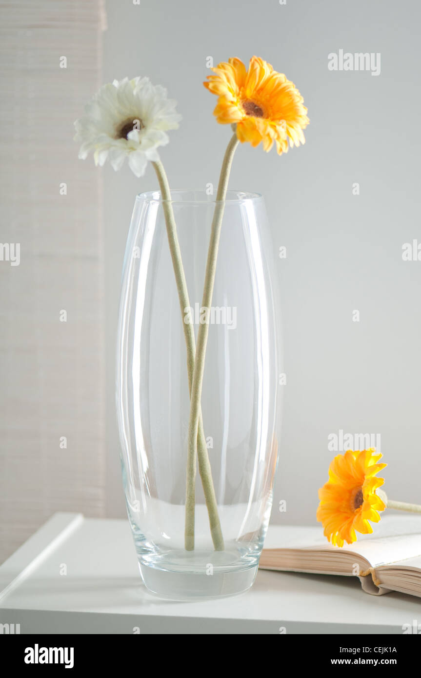 Flower vase made of glass in the interior Stock Photo - Alamy