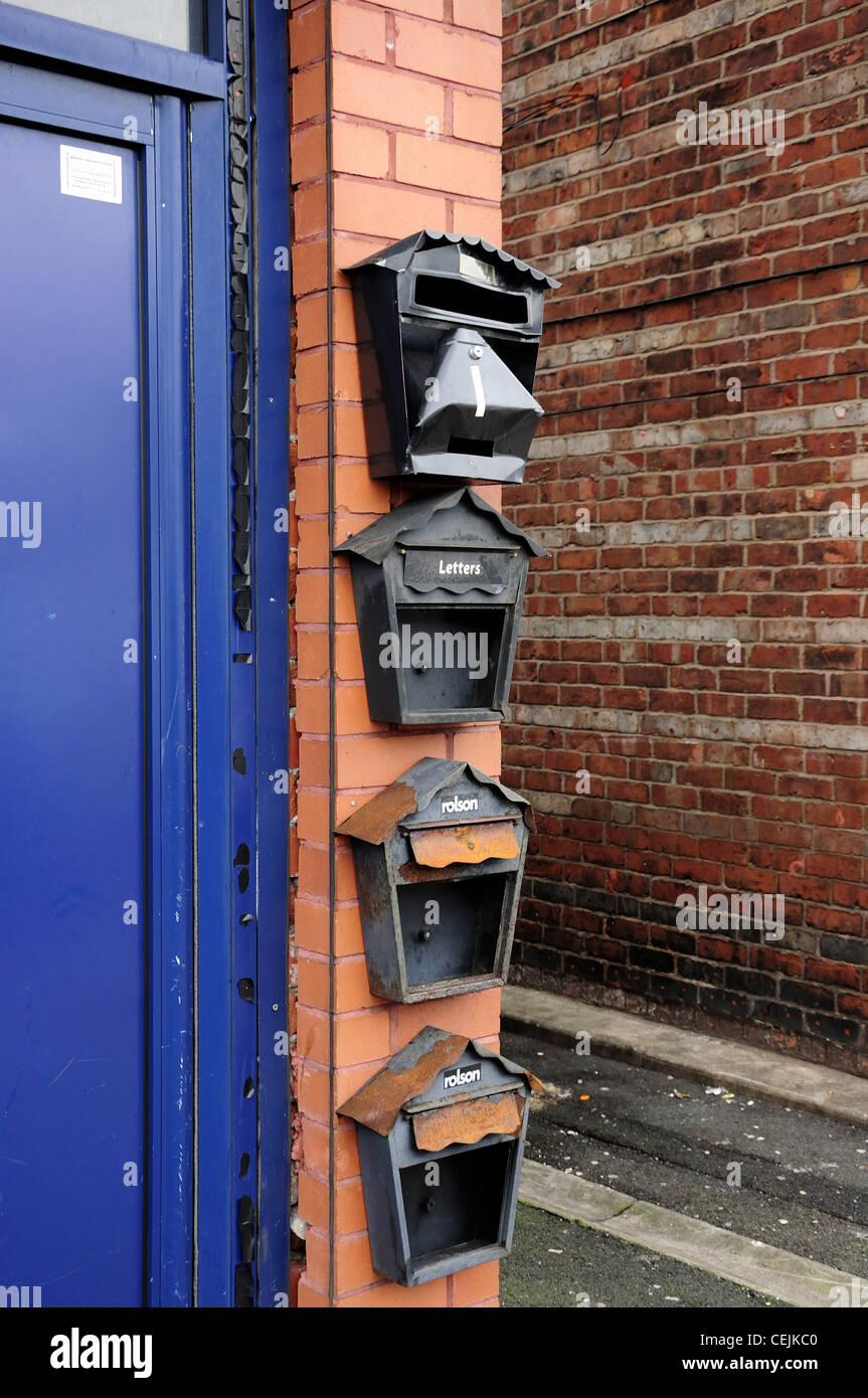 old external letterboxes, broken, fixed to outside wall Stock Photo - Alamy