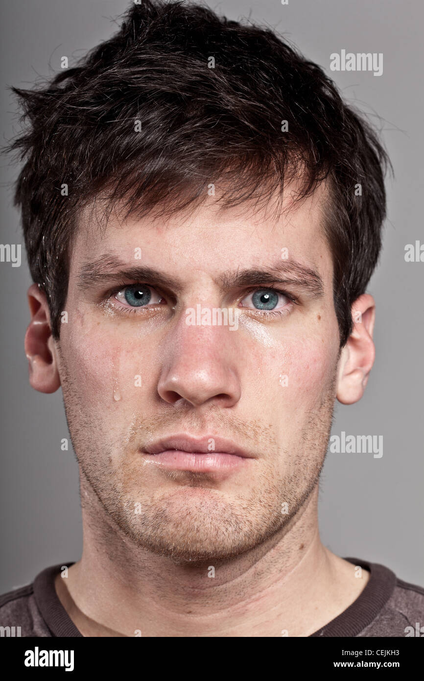 Portrait of a man crying looking into the camera. headshot Stock Photo ...