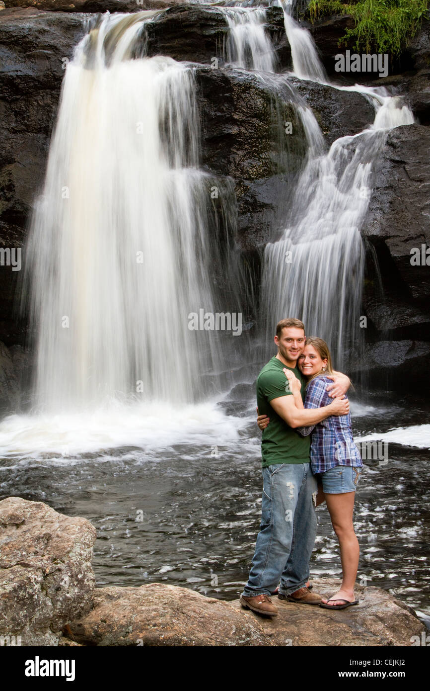 A couple at a waterfall Stock Photo - Alamy