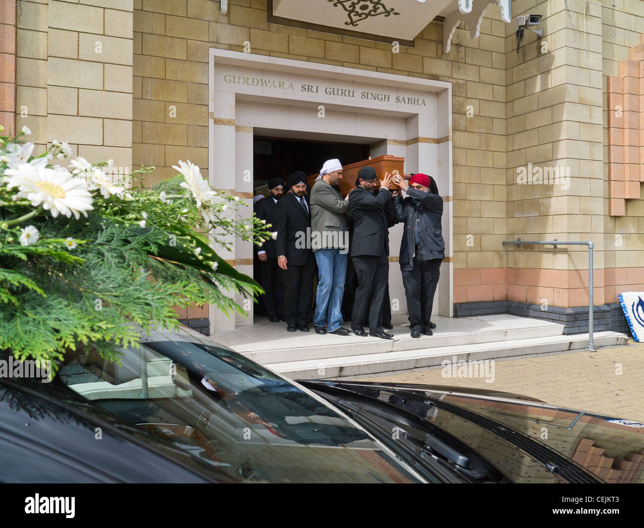 Sikh Funeral with Coffin being carried out of Gurdwara or Temple Stock Photo - Alamy