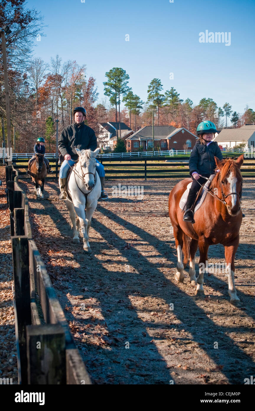 Young girls take horseback riding lessons Stock Photo - Alamy