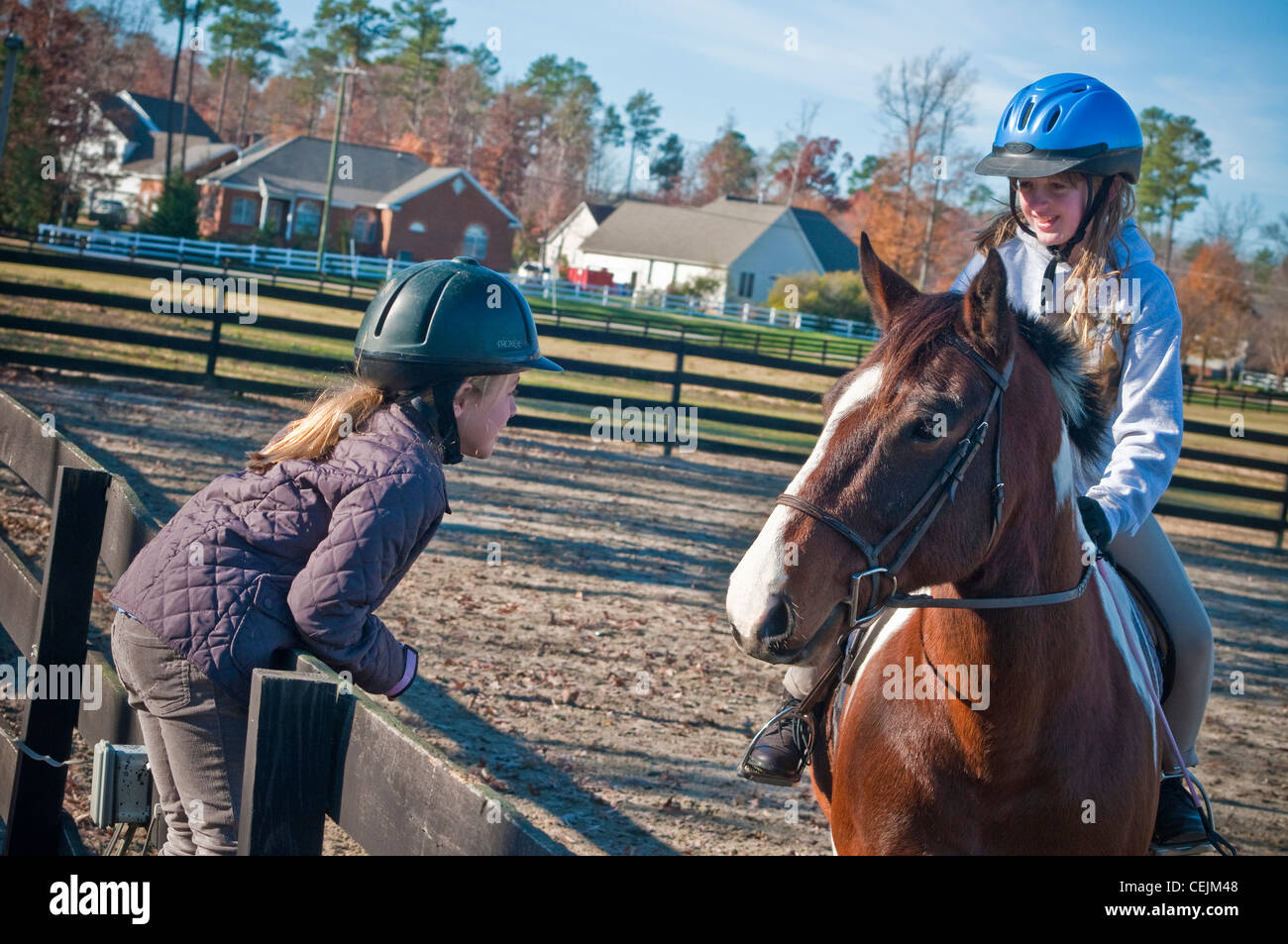 Young girls take horseback riding lessons Stock Photo - Alamy