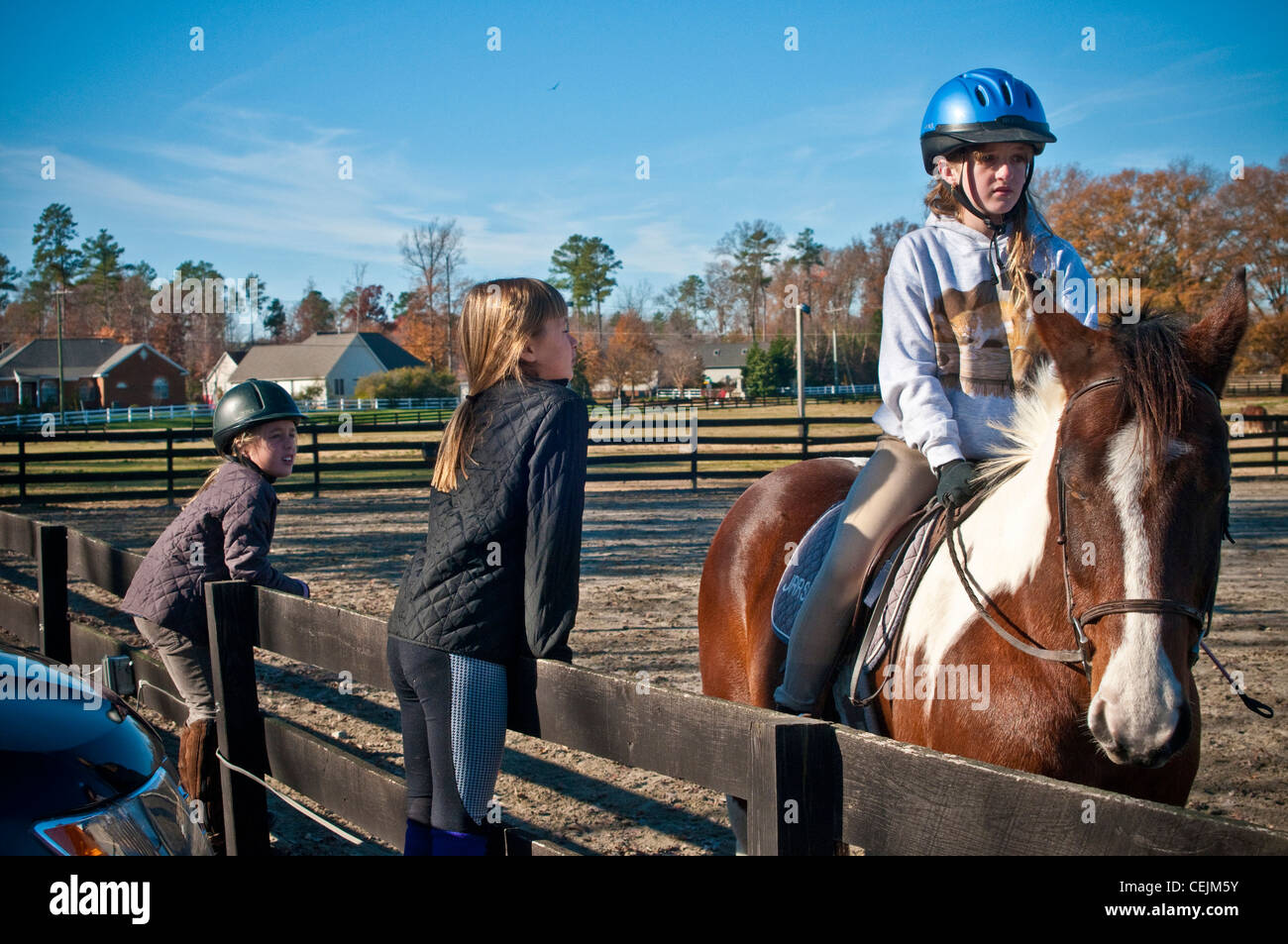 Young girls take horseback riding lessons Stock Photo - Alamy