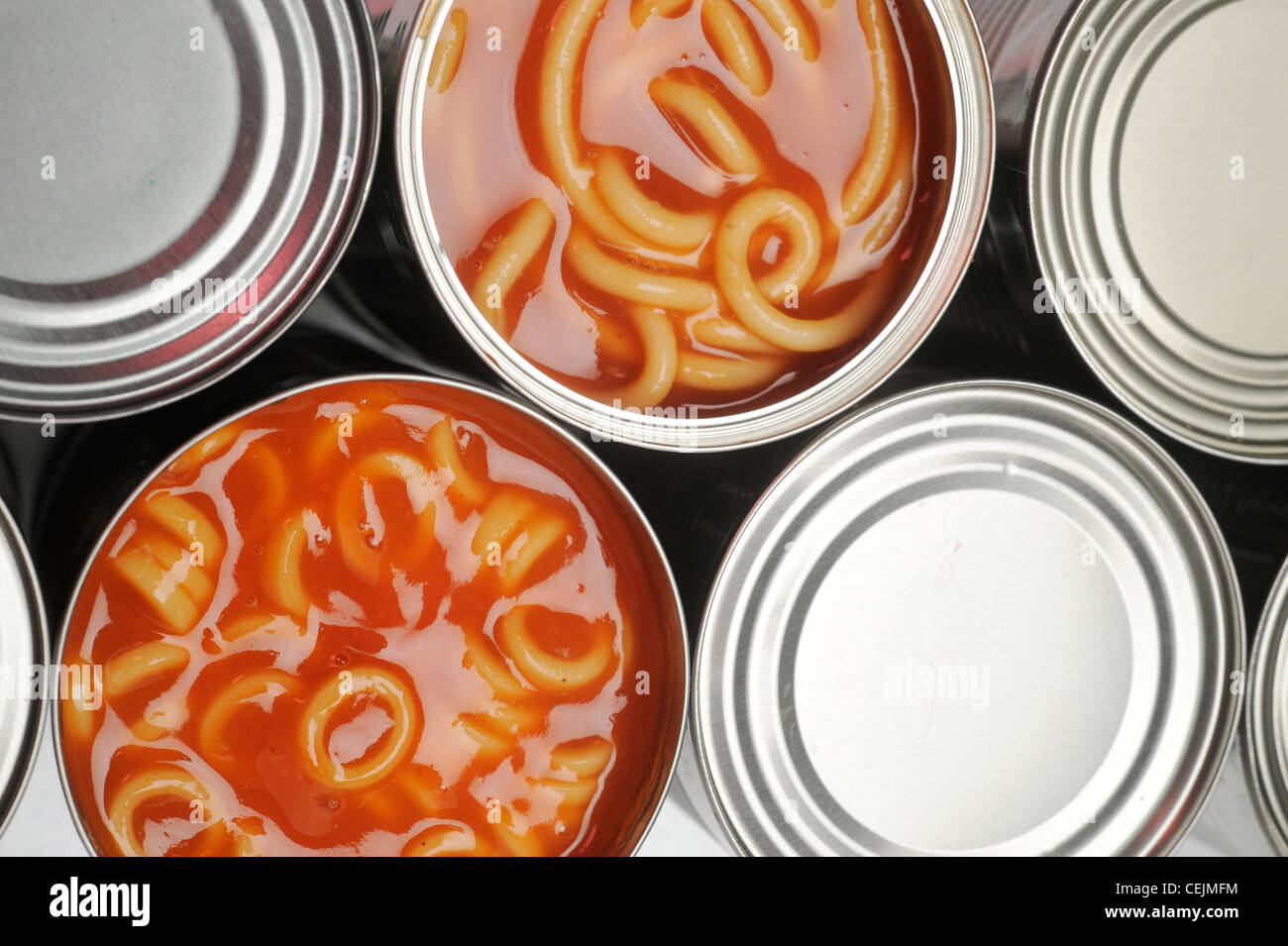 Years Of The Tin Can A still life image of a group of opened and closed ...