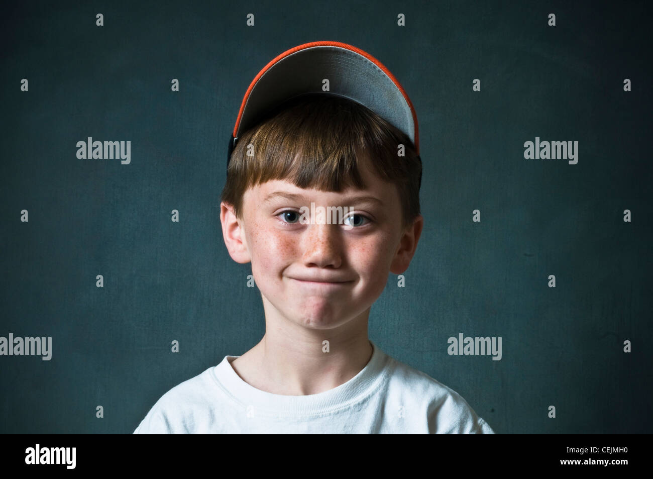 Young boy, funny face, baseball cap Stock Photo - Alamy