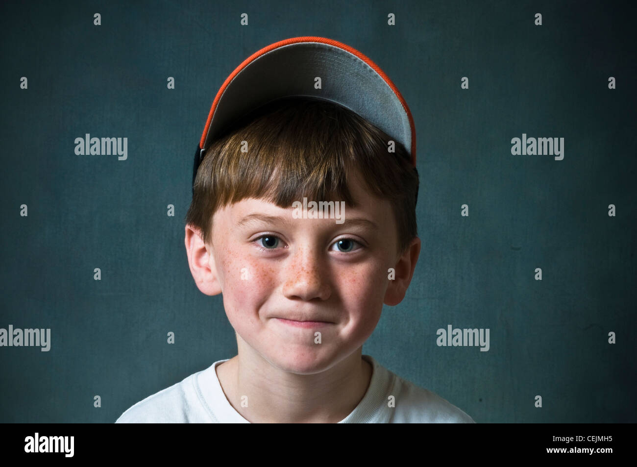 Young boy, funny face, baseball cap Stock Photo - Alamy