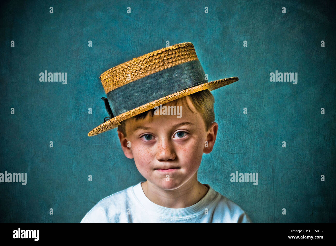 Young boy, funny face, straw hat Stock Photo - Alamy