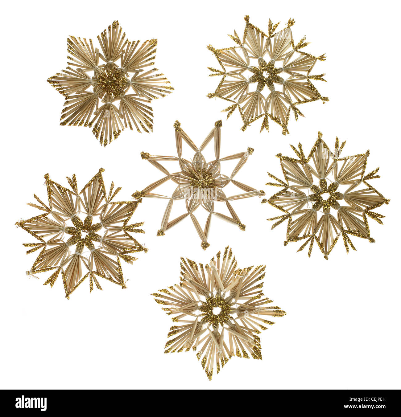 Studio photography of a arrangement of straw stars isolated on white ...