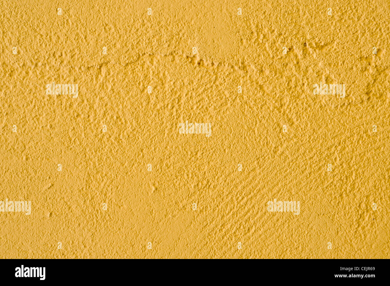 Yellow textured concrete wall Stock Photo - Alamy