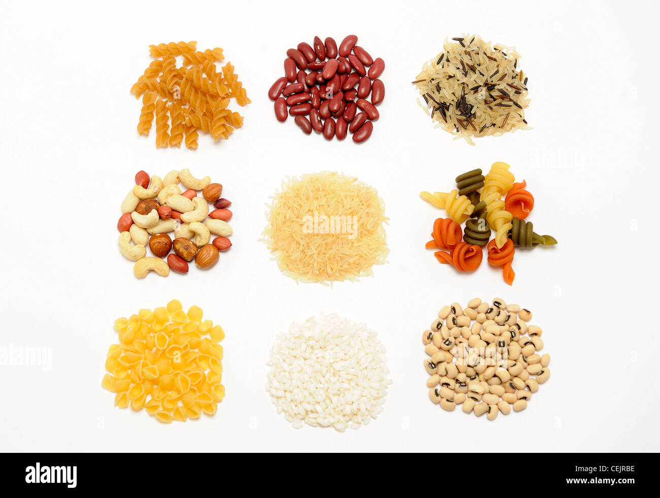 Small piles of different types of carbohydrates a white background ...