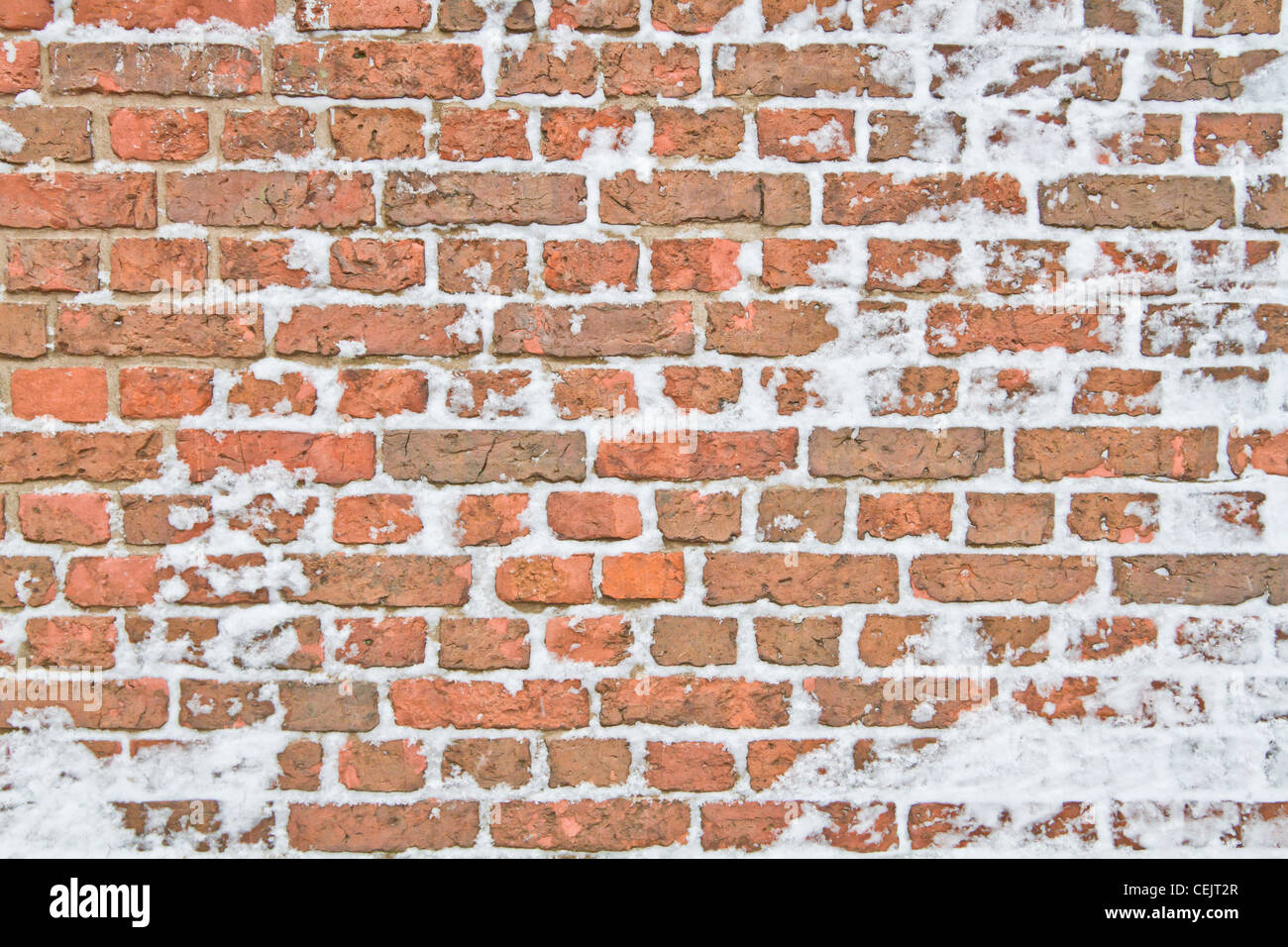 Old snowy wall made from red brick Stock Photo - Alamy
