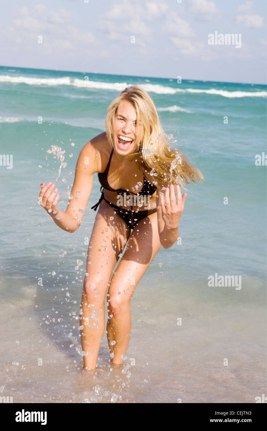 Female Very Long Blonde Hair Wearing Brown Halter Neck Bikini Standing