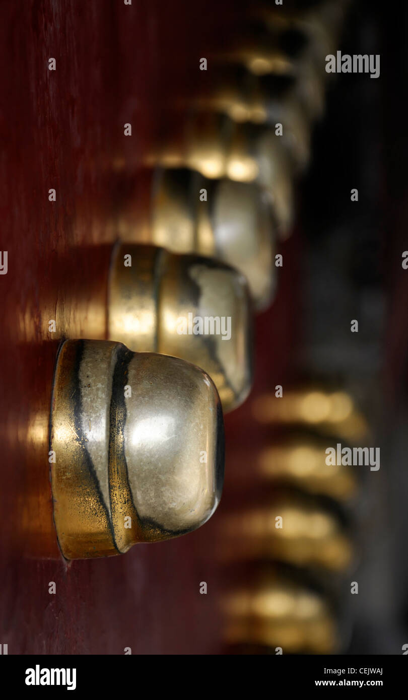 Detail detailed heavy bronze stud studded red door gate entrance ...