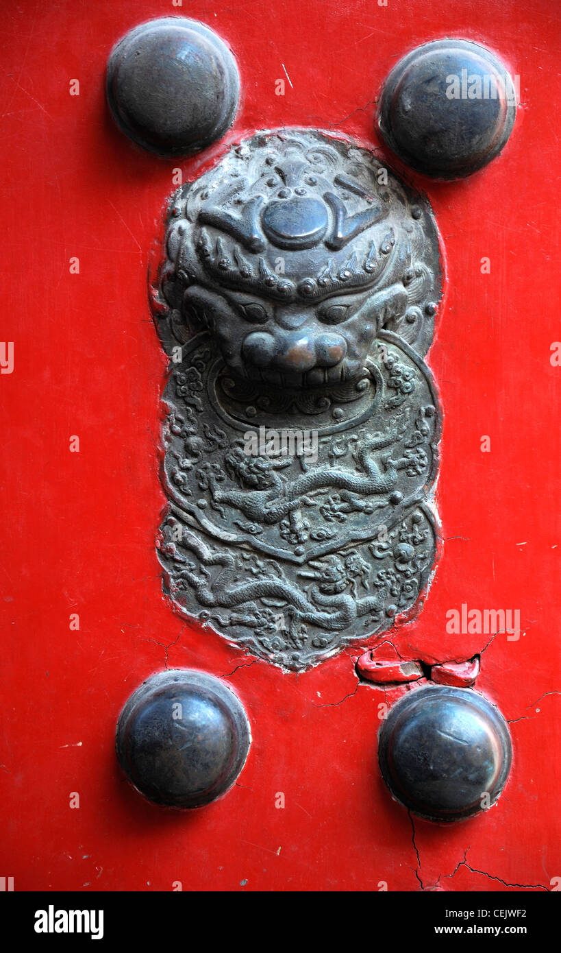 Detail detailed heavy bronze stud studded red door gate entrance ...