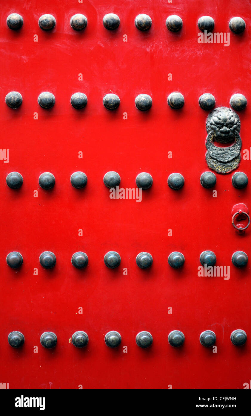 Detail detailed heavy bronze stud studded red door gate entrance ...