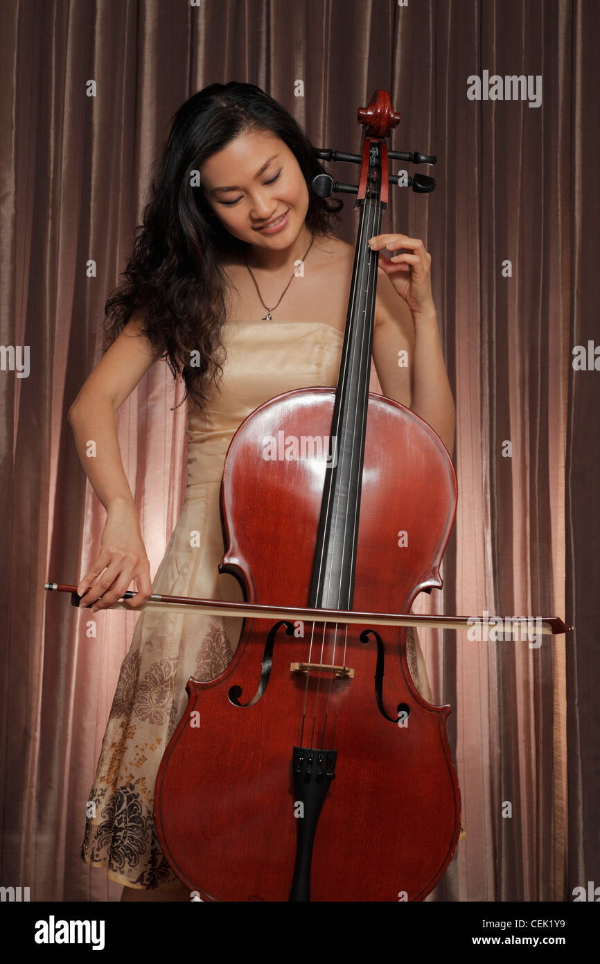 Woman playing cello hi-res stock photography and images - Alamy