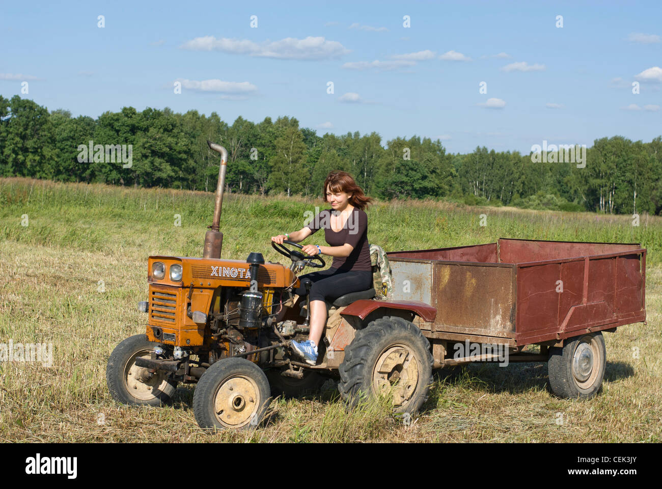 Woman driving tractor hi-res stock photography and images - Alamy