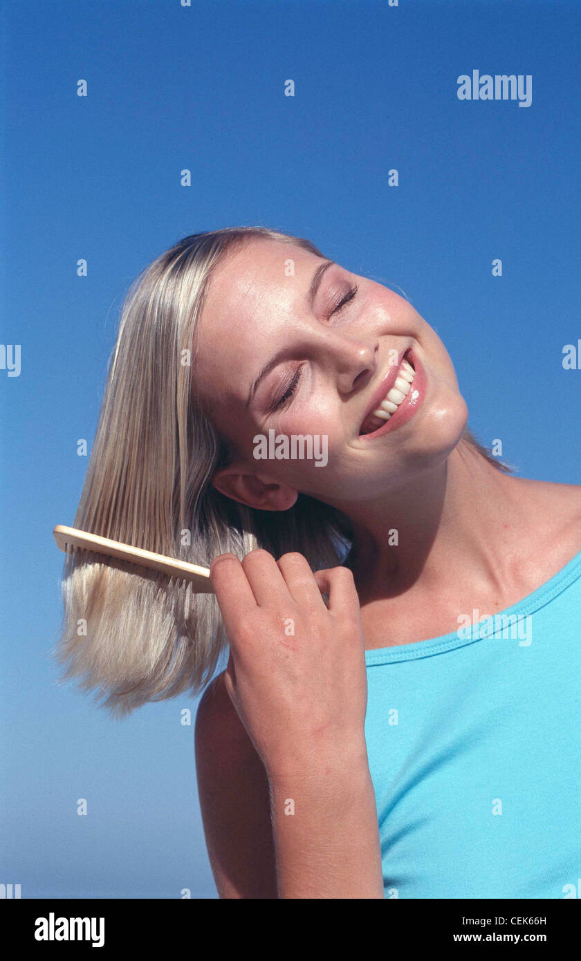 Tanned female chin length blonde hair wearing subtle make up and ...