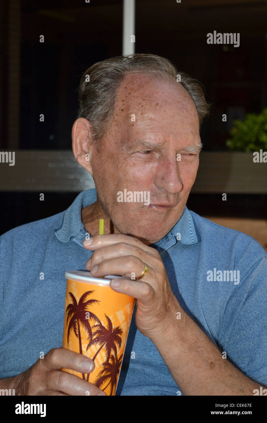 old retired man drinking a milkshake Stock Photo - Alamy
