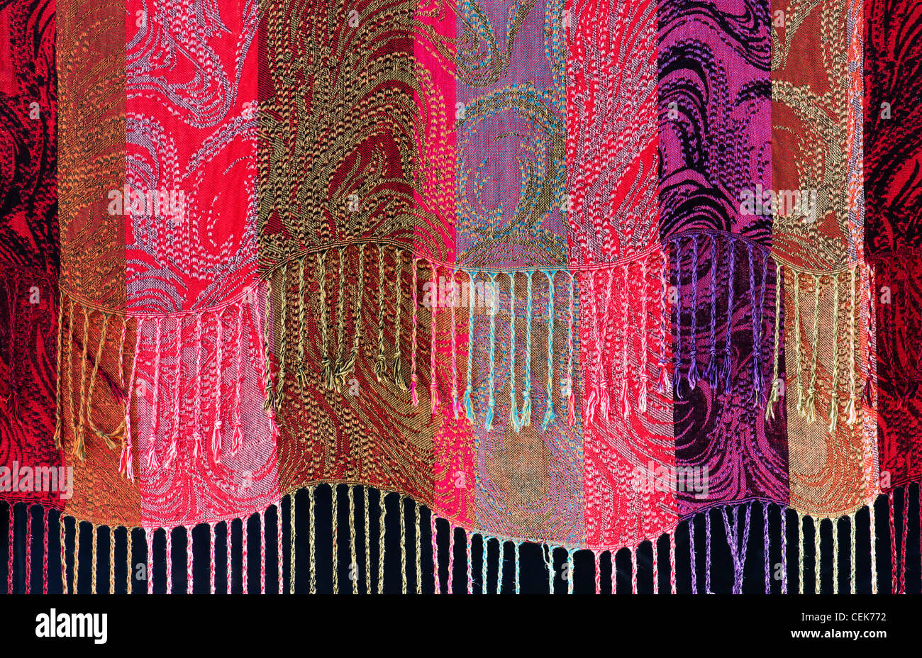 Colourful indian womans shawl against a dark background Stock Photo - Alamy