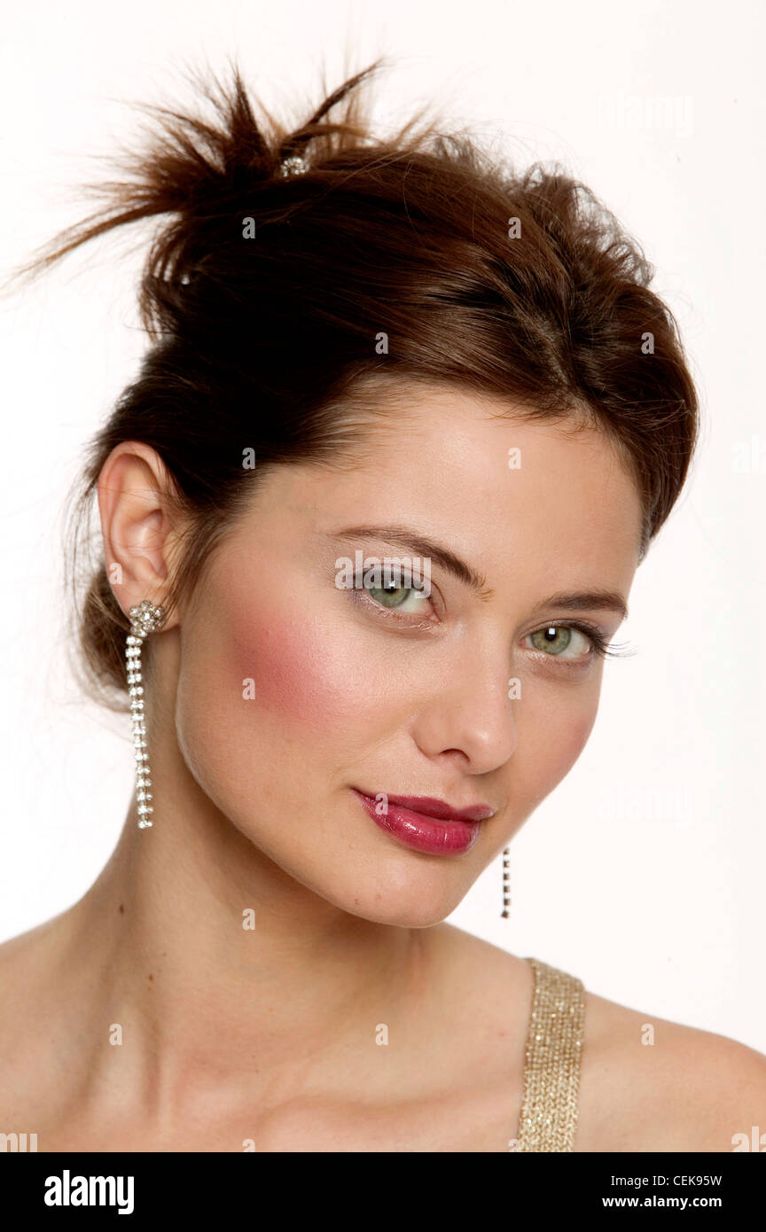 Female brunette hair off face, dark red lipstick and dangly silver ...