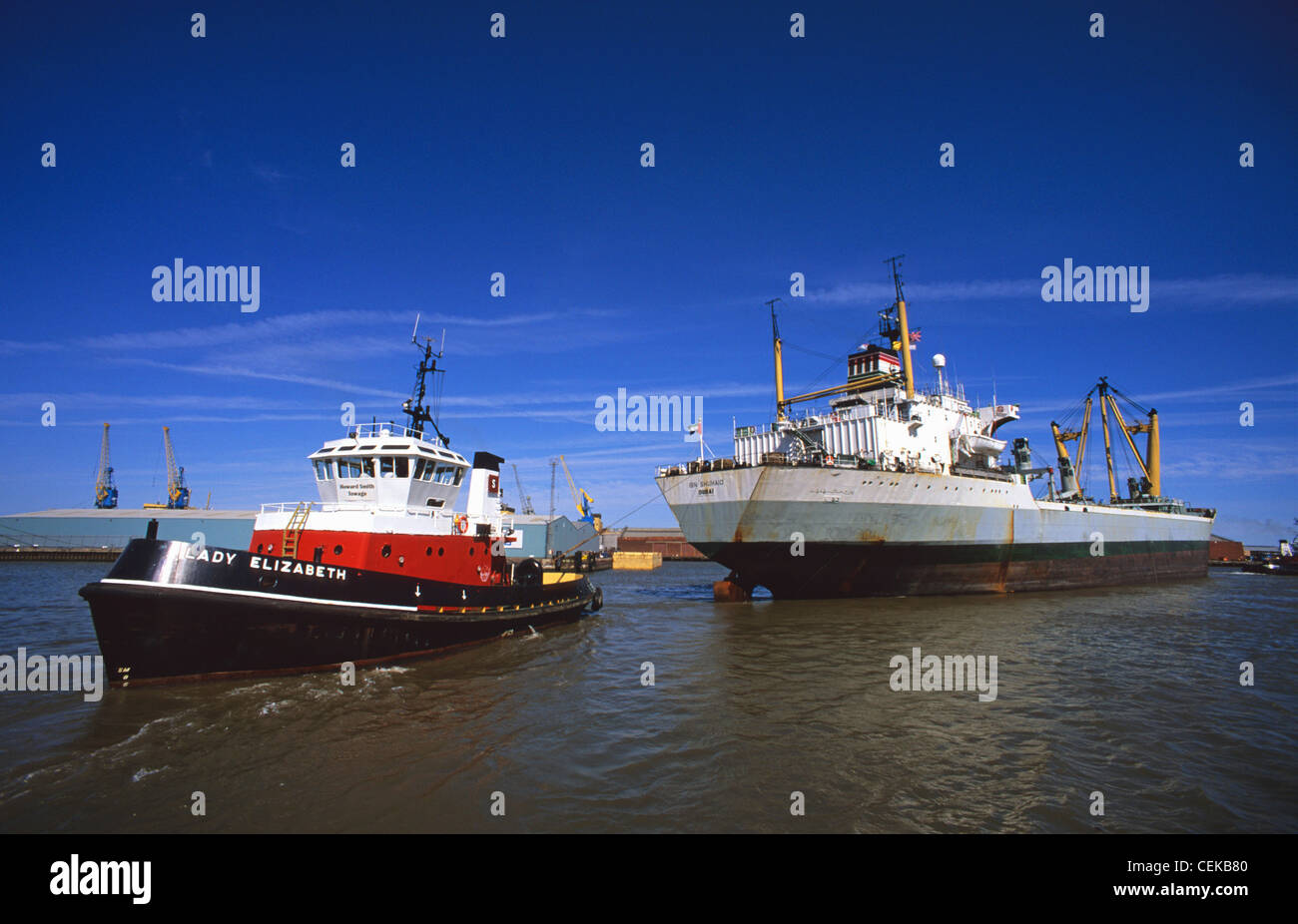 tug boat towing freighter into lock at the port of hull docks hull uk ...