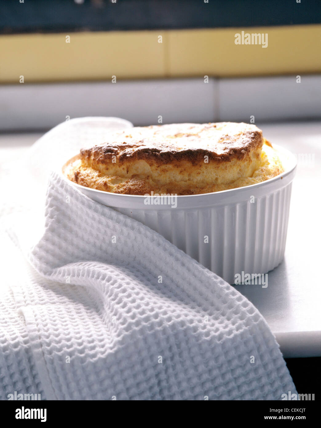 Souffle Preheat the oven to C, gas mark Grease a litre souffle dish a ...